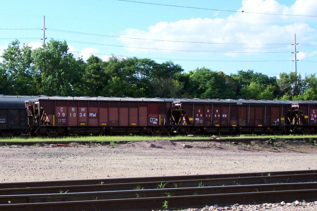 Ex-Rock Island ballast cars, now stenciled for CNW, remain in service on the UP